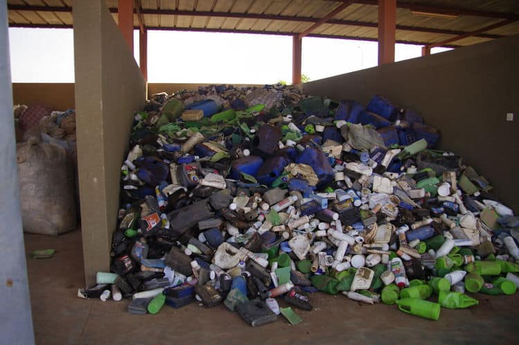 Plastic waste in a shed awaiting separation by colour at a recycling ...